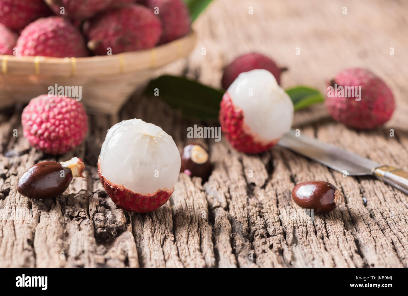 fresh lychee fruit (Litchi chinensis) on old wood background Stock ...