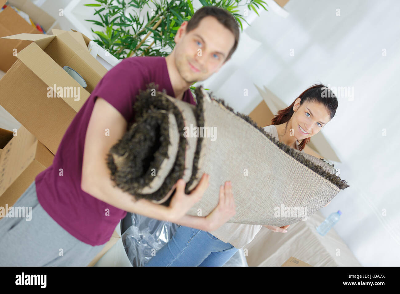 Man carrying rolled carpet hi-res stock photography and images - Alamy