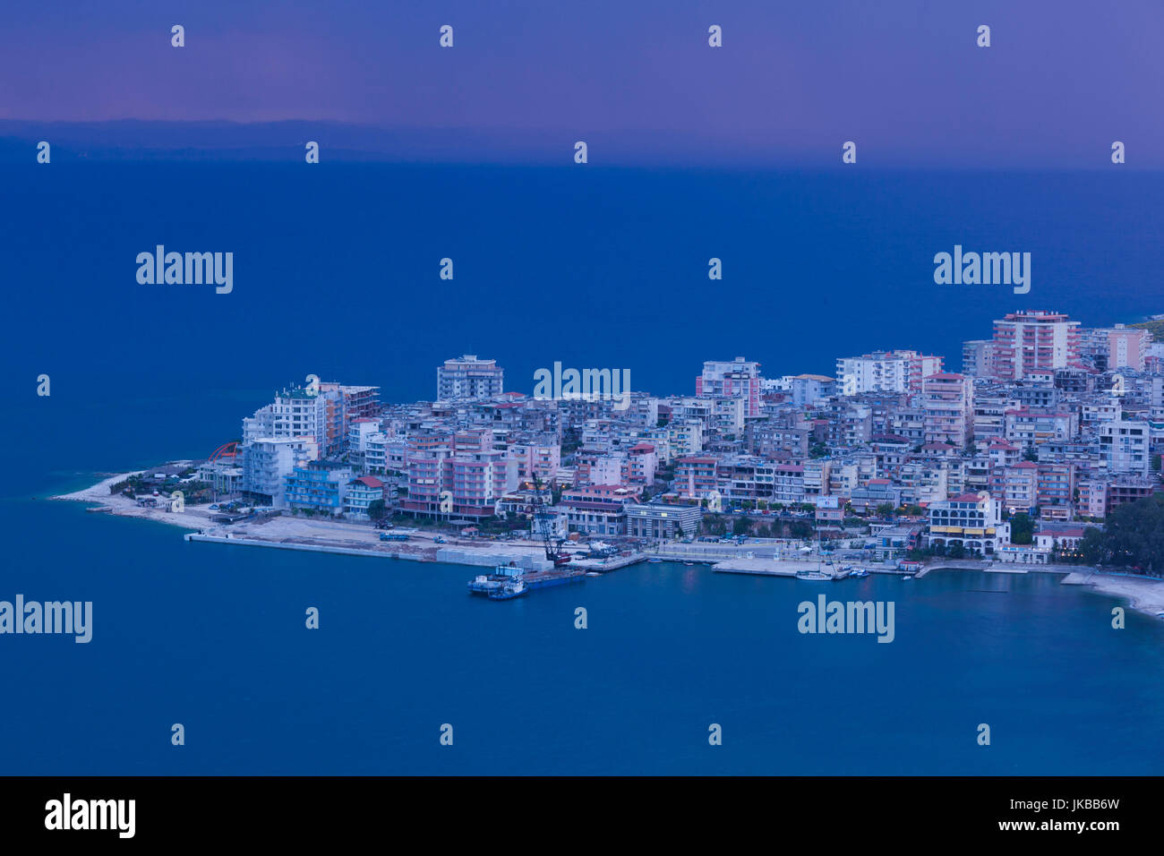 Albania, Albanian Riviera, Saranda, elevated city view, dusk Stock ...