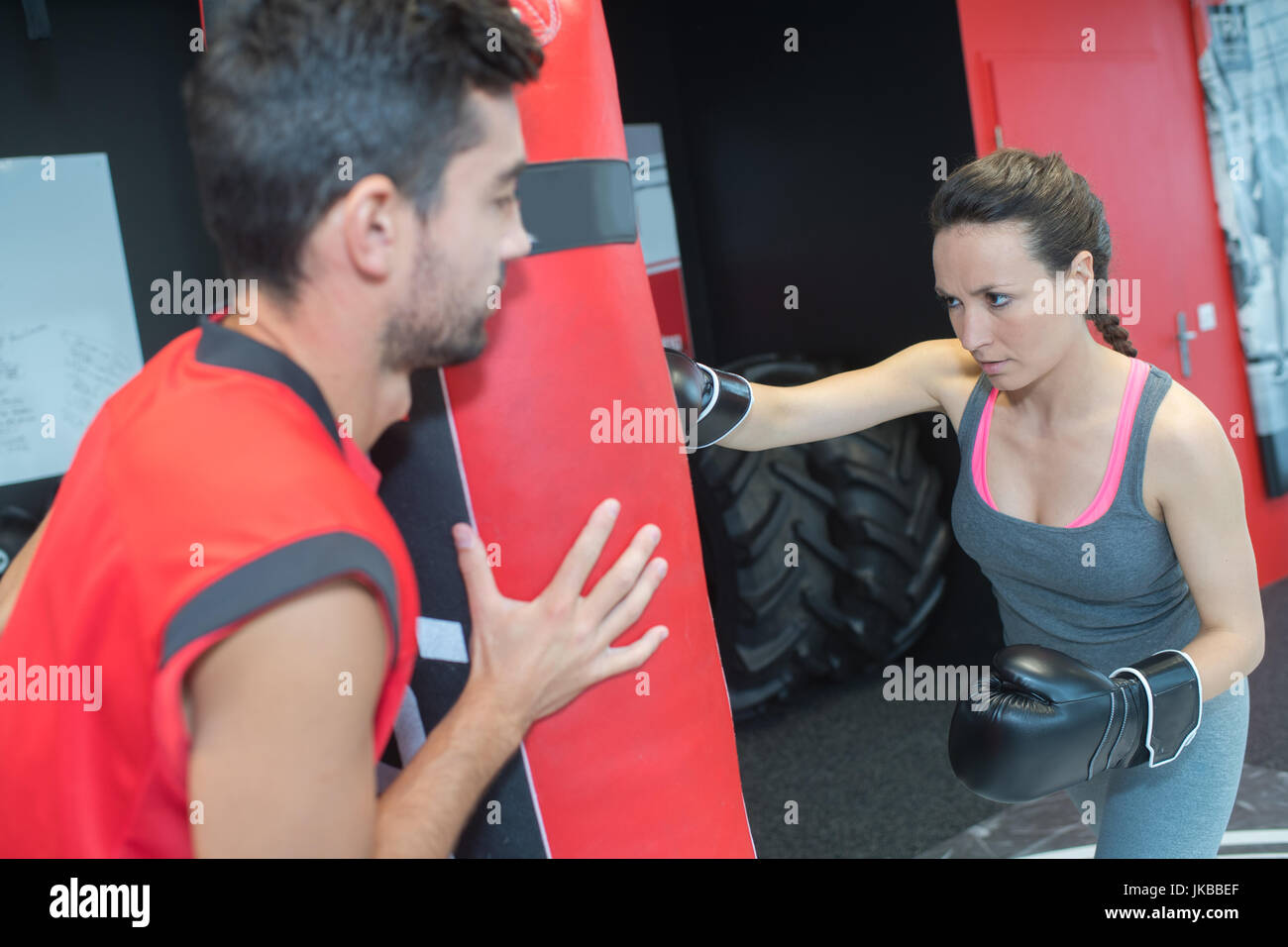 woman boxing in a gym with her coach Stock Photo - Alamy