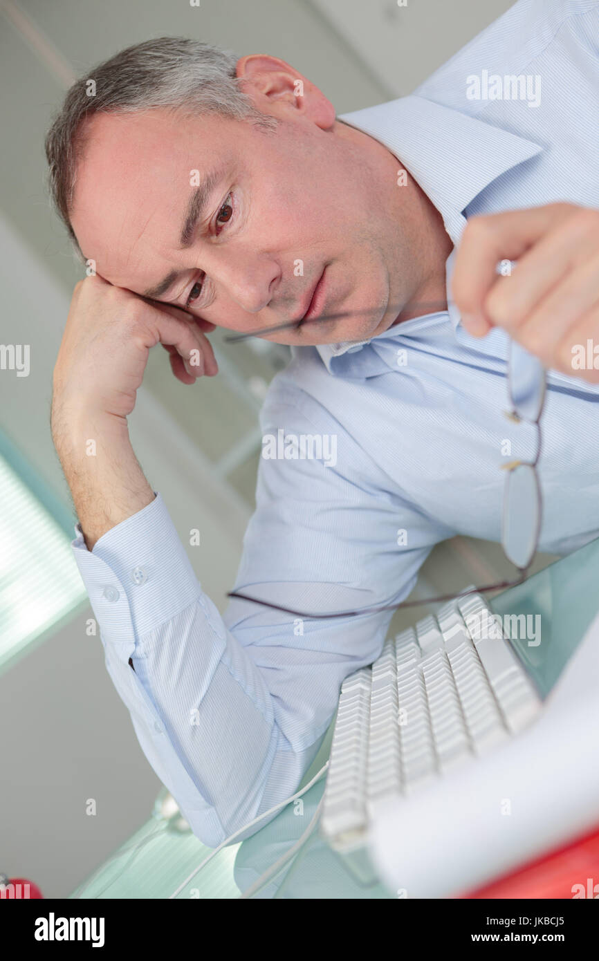 depressed businessman in office Stock Photo - Alamy