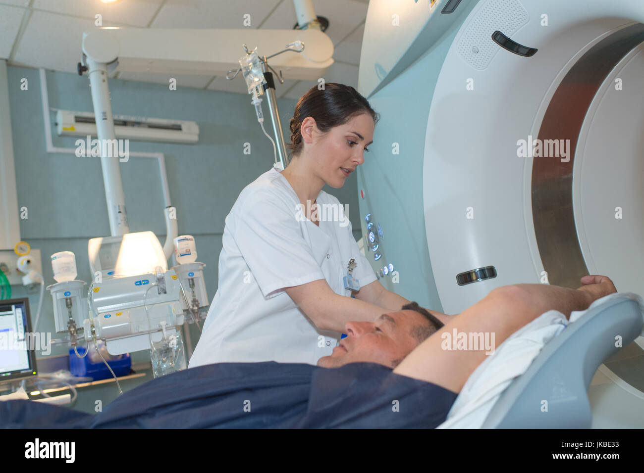 nurse taking care of patient entering into mri machine Stock Photo - Alamy
