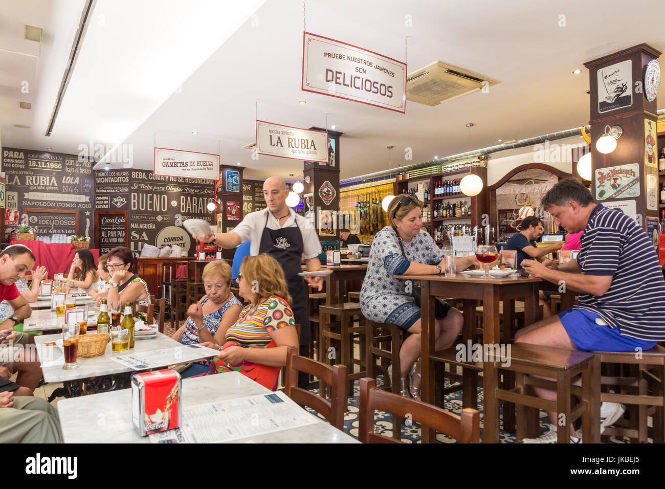 People eating lunch in Casa Lola rstaurant and tapas bar, Malaga, Spain ...