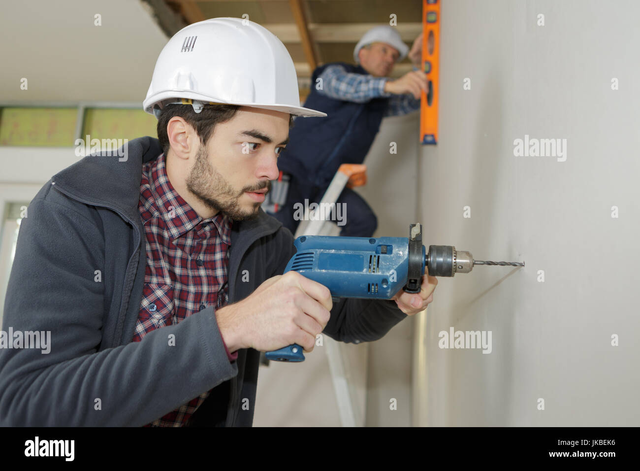 construction site workers drilling with a machine or dri Stock Photo ...