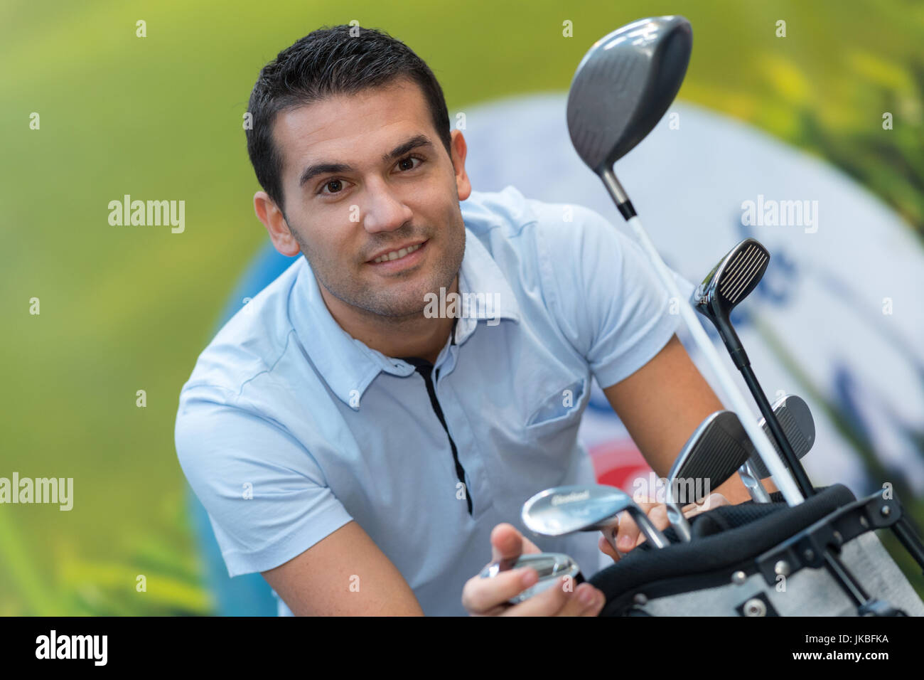 man with golf club Stock Photo - Alamy
