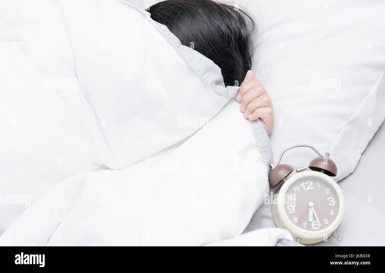 Girl sleeping under covers hi-res stock photography and images - Alamy