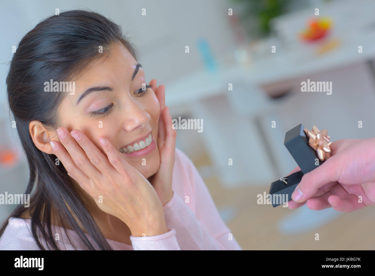 man giving engagement ring to woman Stock Photo - Alamy