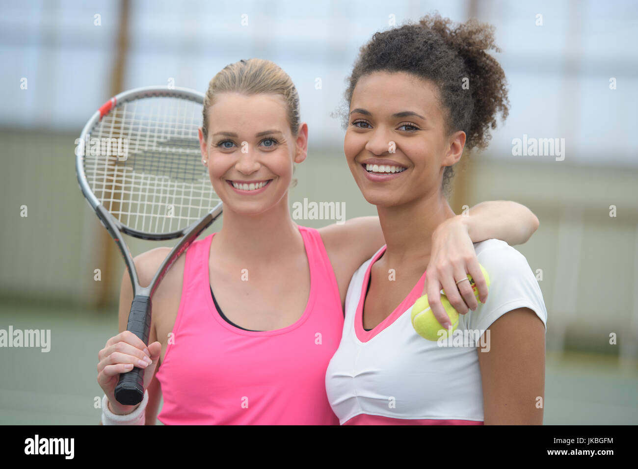 female tennis players playing doubles at the tennis court Stock Photo ...