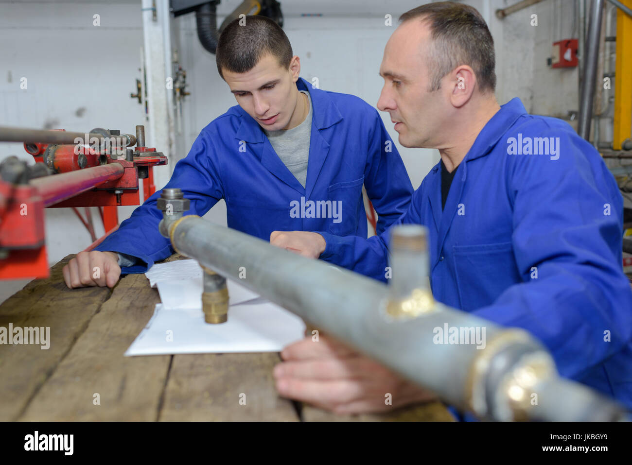 young plumber and manager Stock Photo - Alamy