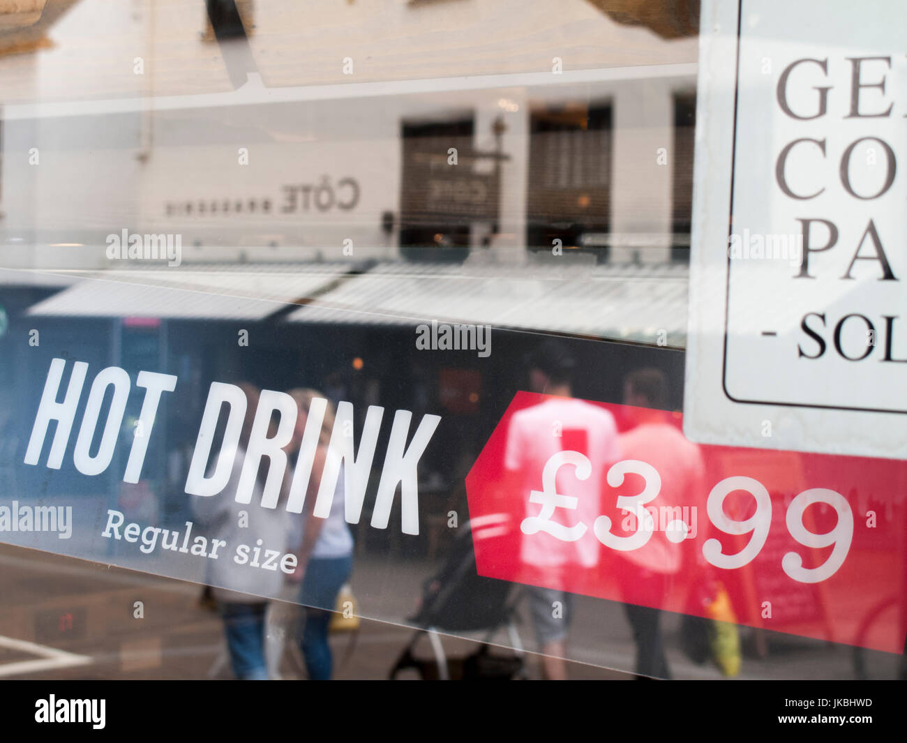 Regular size hot drink advertisement price sign in cafe window Stock ...