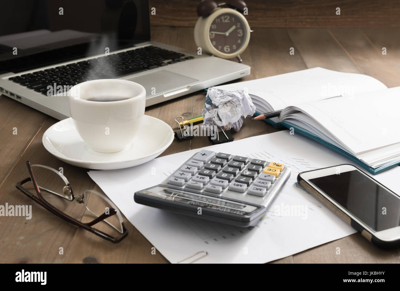 Hot coffee with computer notebook mobile phone on wood table, business ...