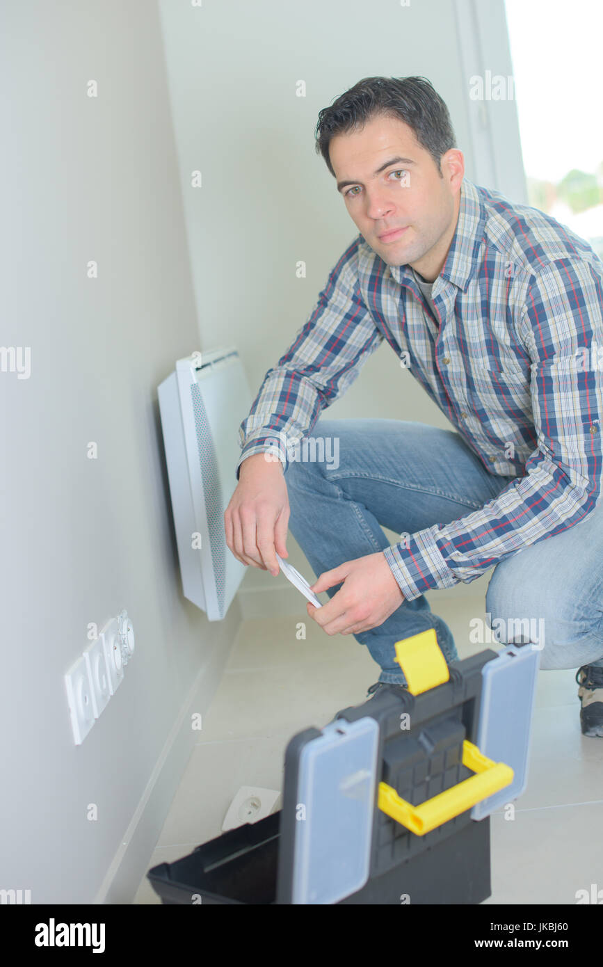 Electrician fixing socket hi-res stock photography and images - Alamy