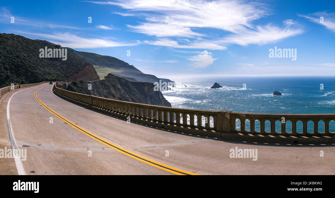 Coast and road seen with a small unrecognizable car Stock Photo - Alamy