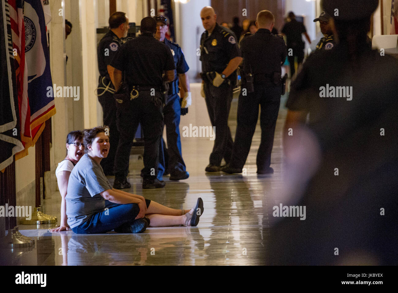 Demonstrator stage a sit-in in the Russell Senate Office Building in ...