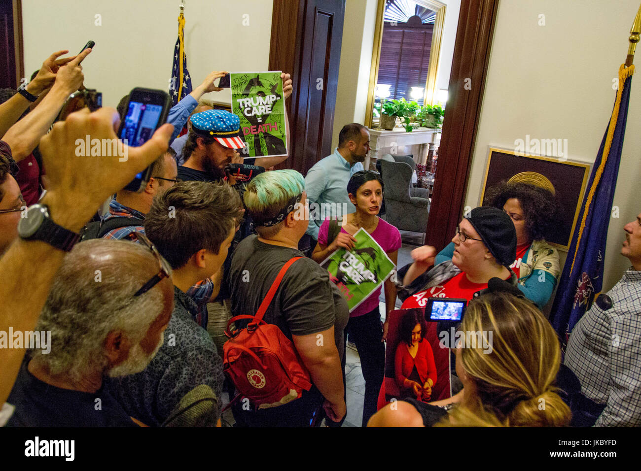 Demonstrators rally outside the office of Senator Pat Toomey (R-PA) in ...