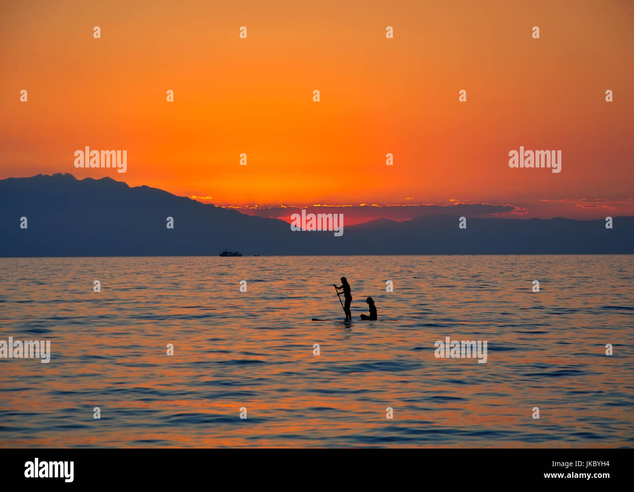 Sunset in greece canoe sup hi-res stock photography and images - Alamy