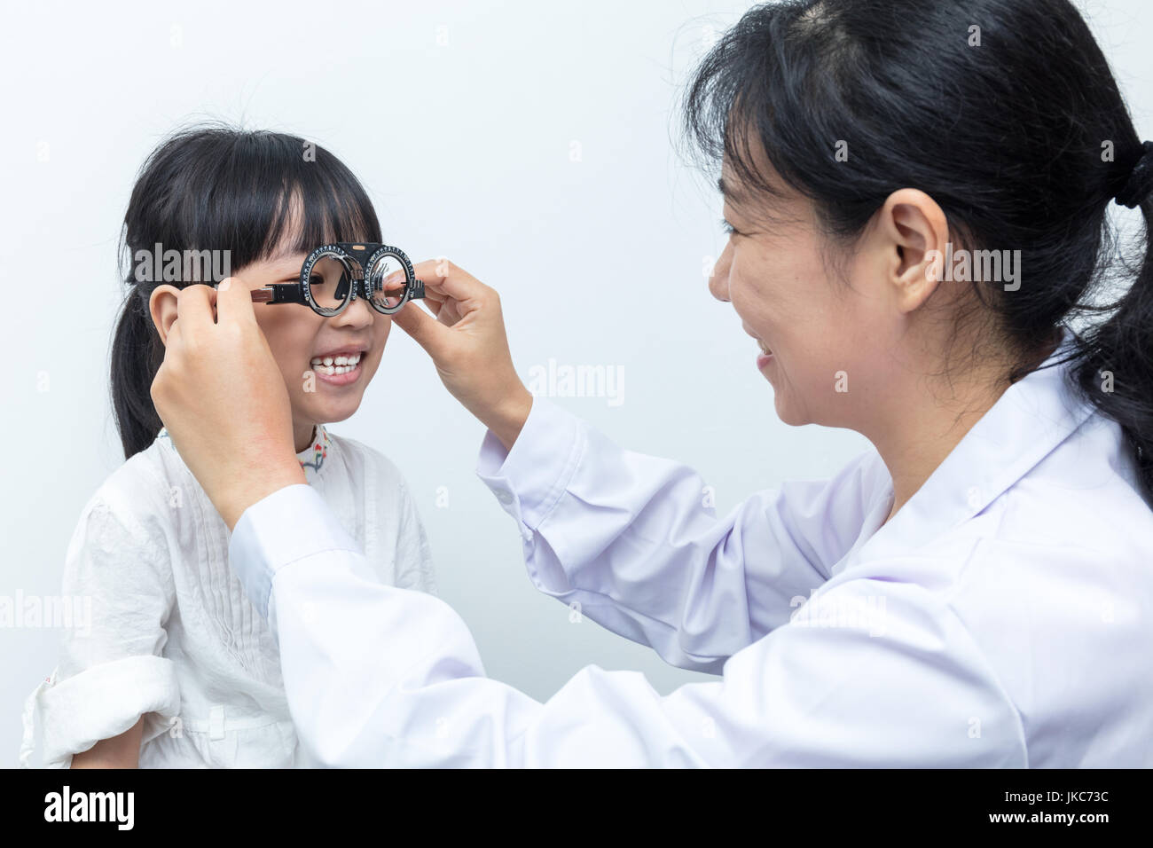 Asian Little Chinese Girl Doing Eyes Examination by ophthalmologist in ...