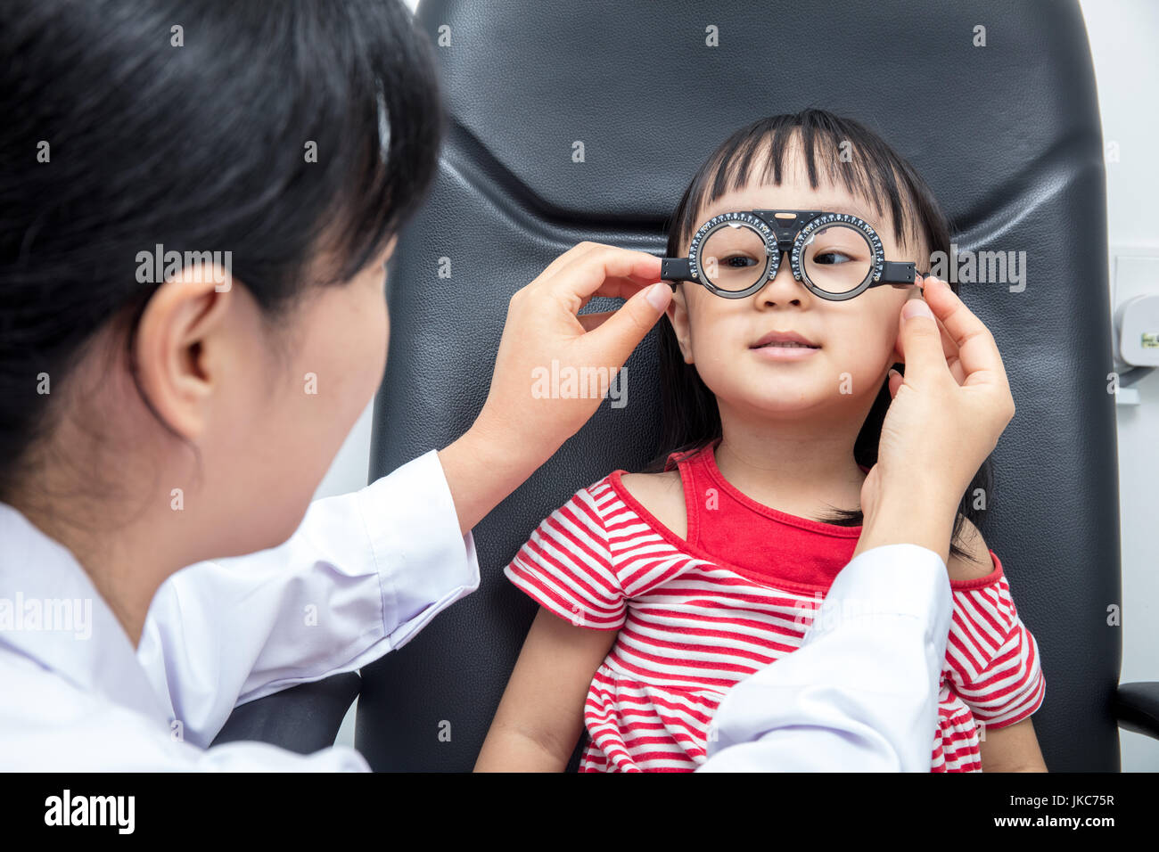 Asian Little Chinese Girl Doing Eyes Examination by ophthalmologist at ...