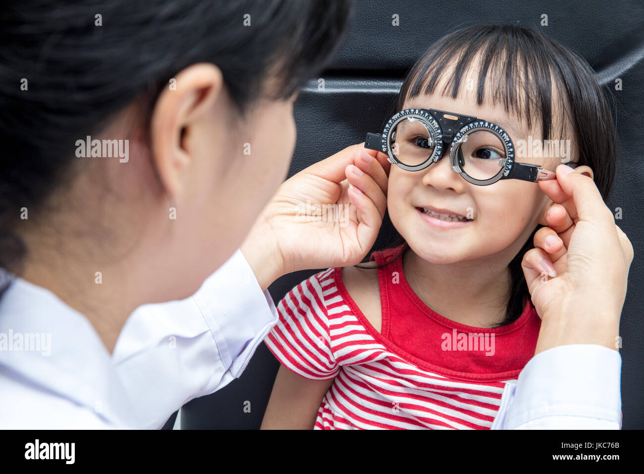 Asian Little Chinese Girl Doing Eyes Examination by ophthalmologist at ...