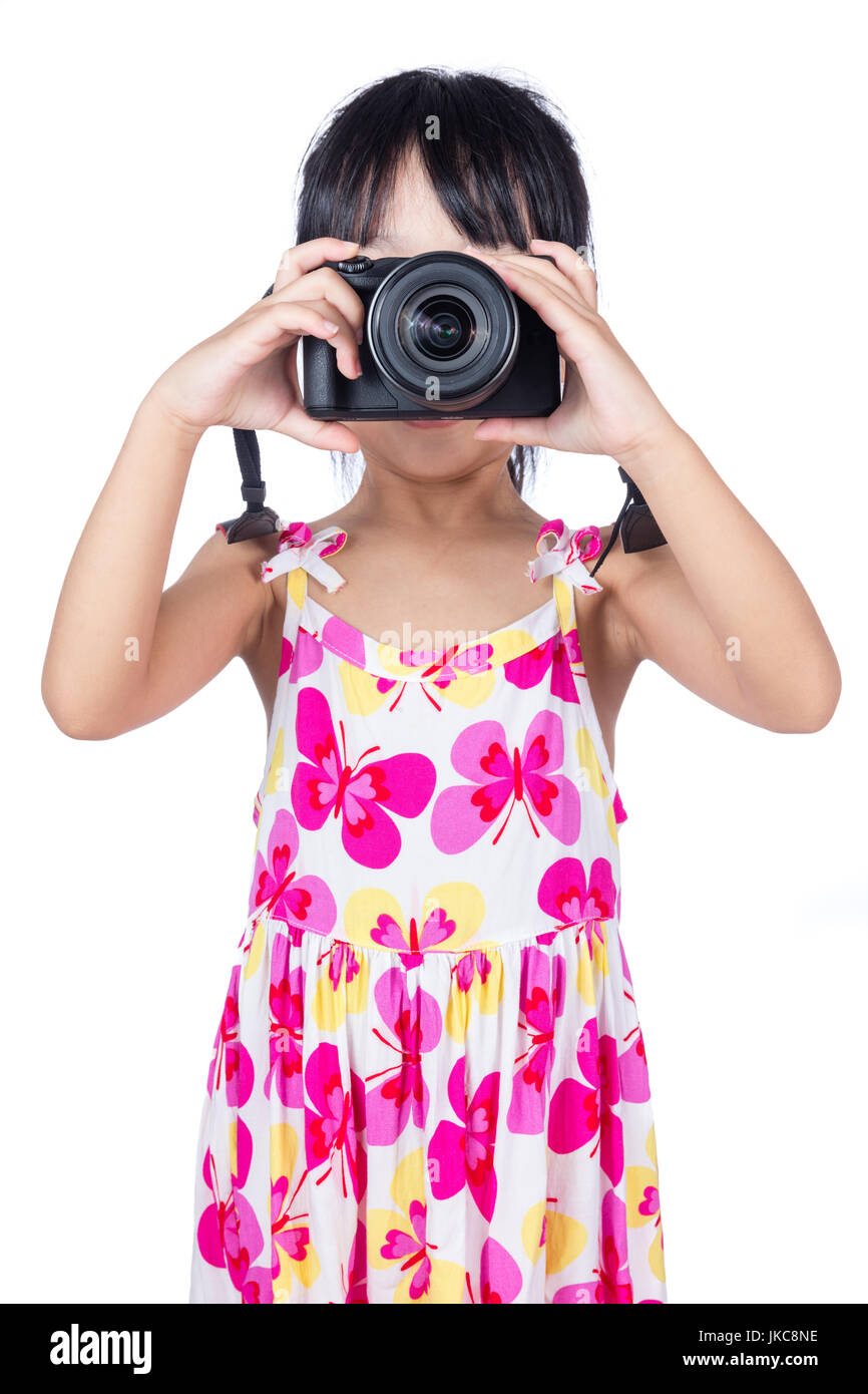 Asian Little Chinese girl holding a camera in isolated white background ...