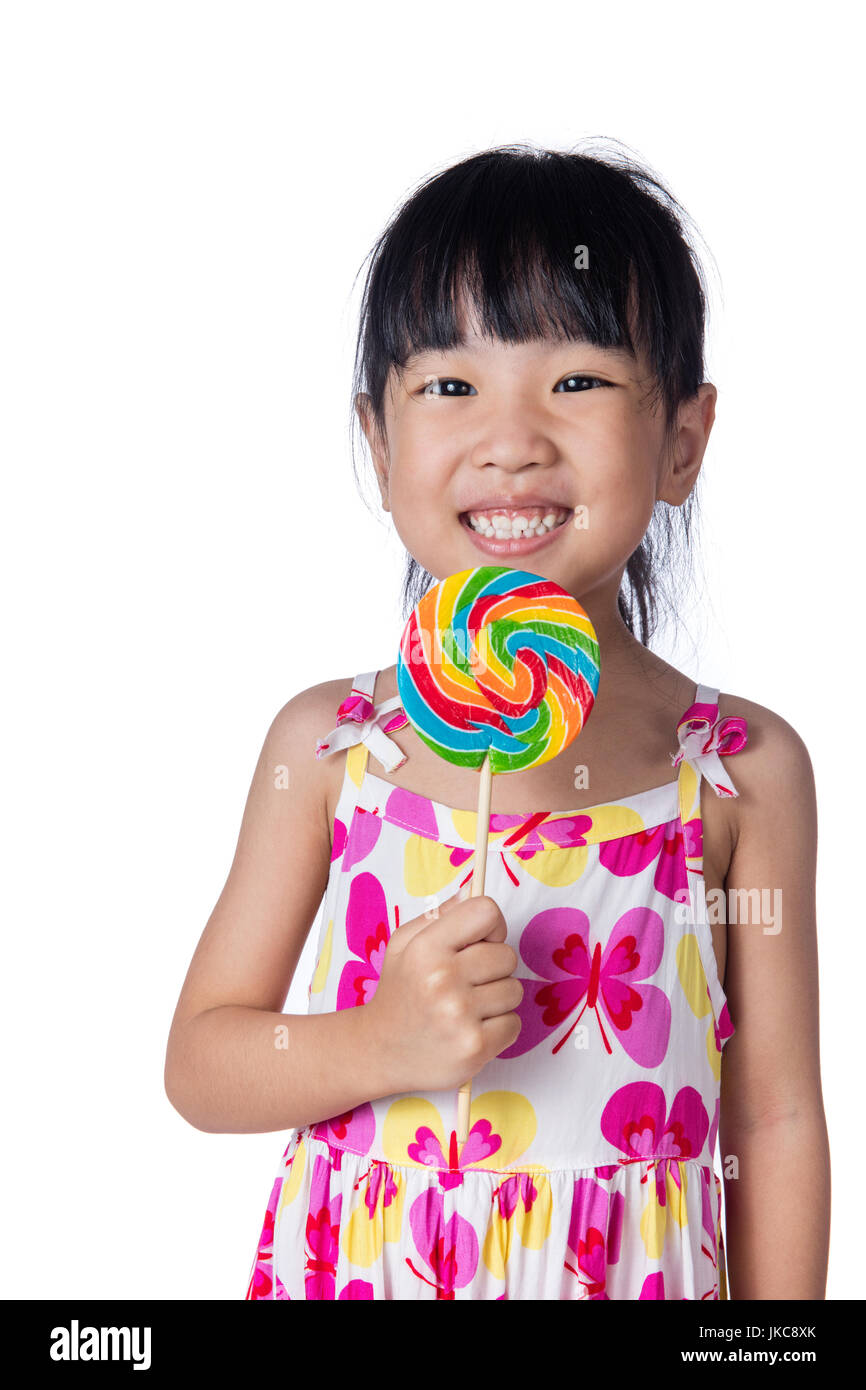 Asian Little Chinese girl holding lollipop in isolated white background ...