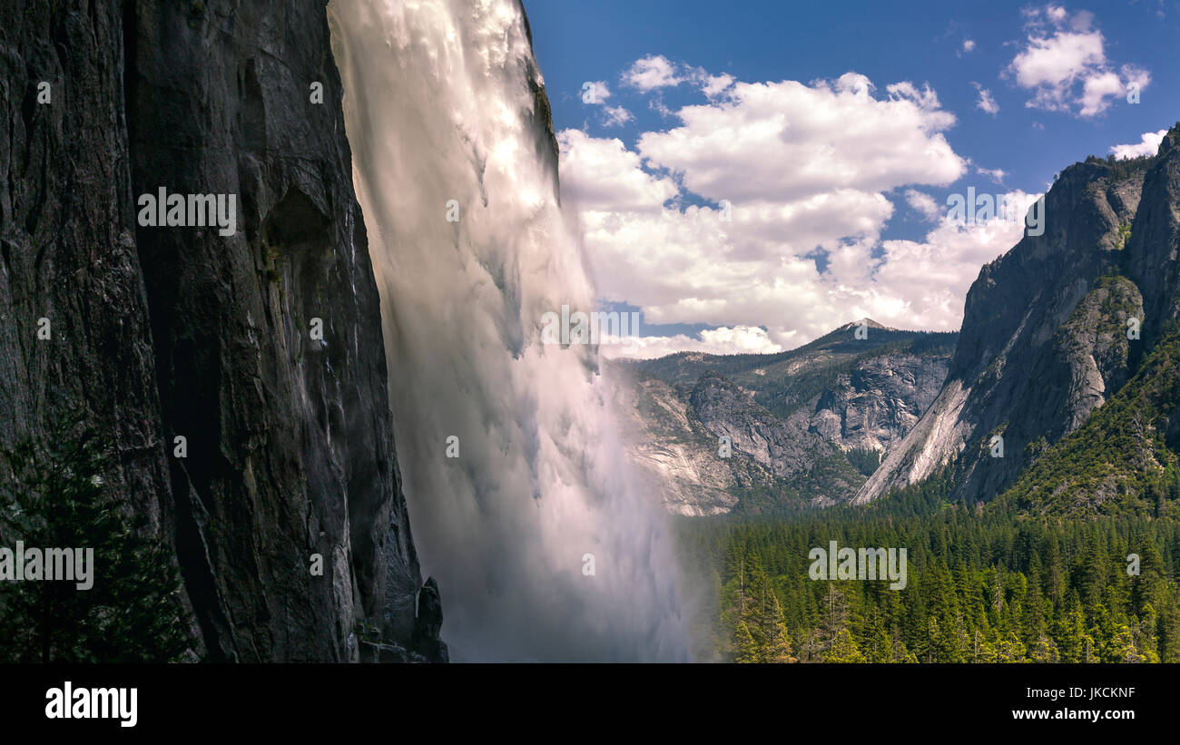 Close up of Yosemite Falls with a glowing stream and background of the ...