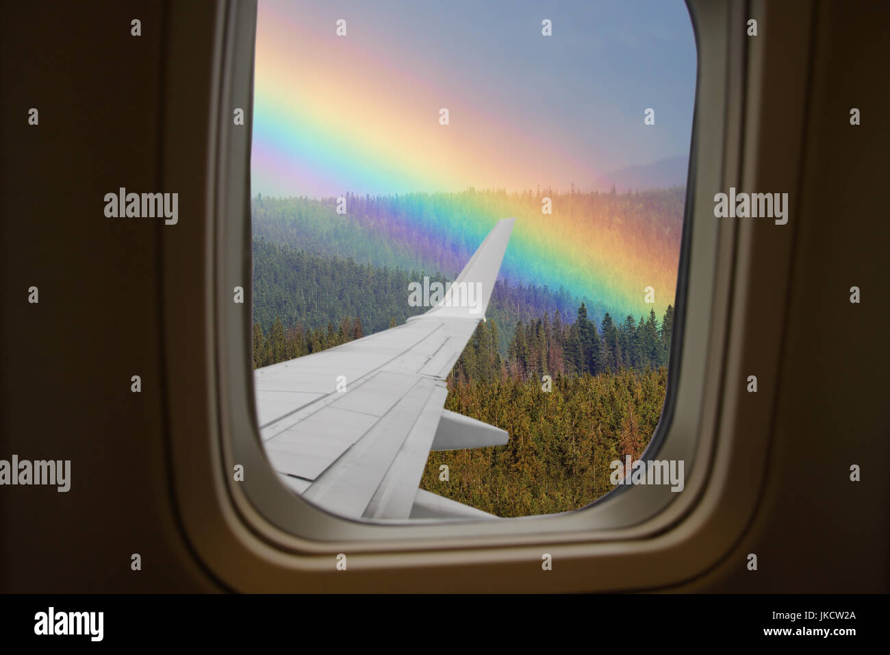 View from airplane window on rainbow Stock Photo - Alamy