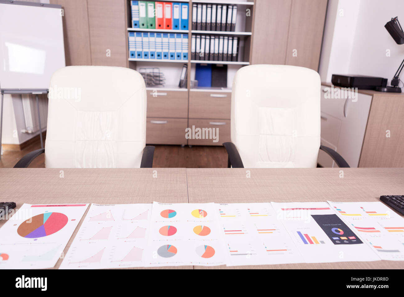 Business charts on a table in business office Stock Photo - Alamy