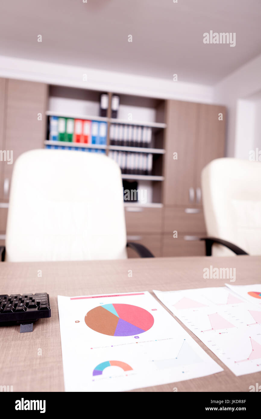 Business charts on a table in business office Stock Photo - Alamy