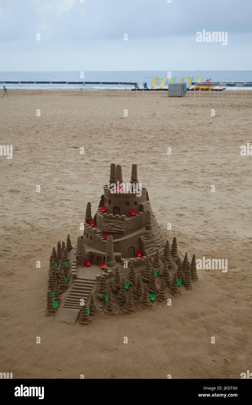 Sand castle in the beach with colorful candles Stock Photo - Alamy