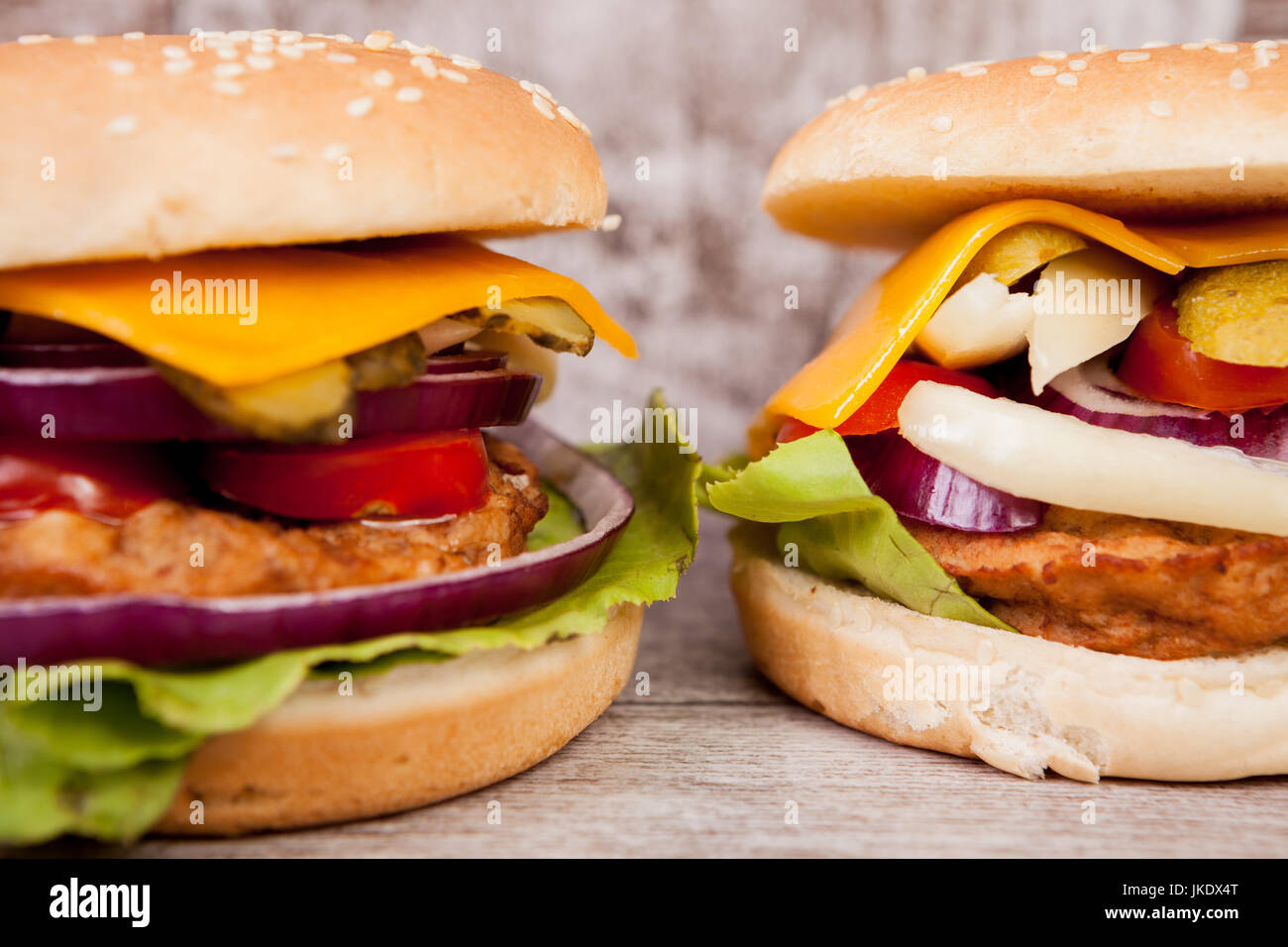 Gourmet burgers on wooden plate Stock Photo - Alamy