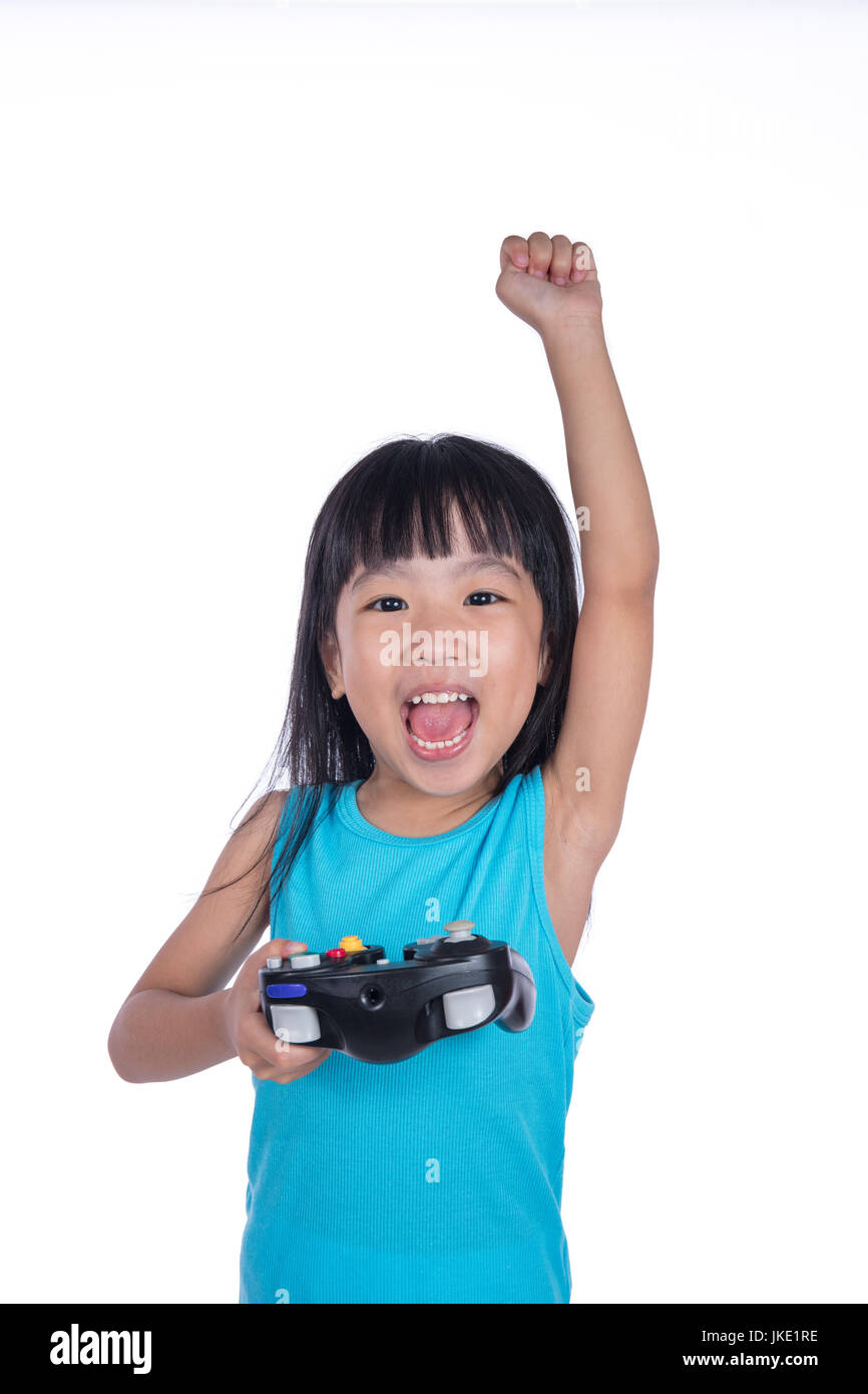 Asian Chinese little girl playing game with controller in isolated ...