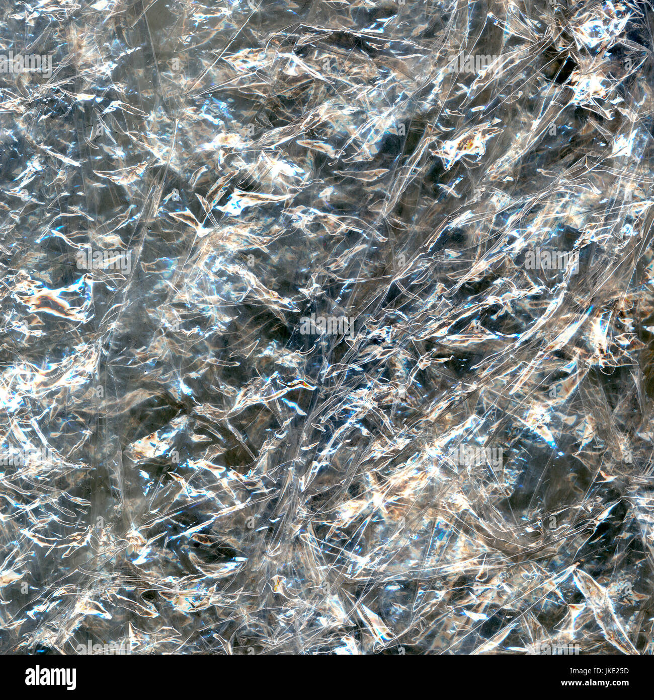 Background from crumpled transparent cellophane with colorful effects ...