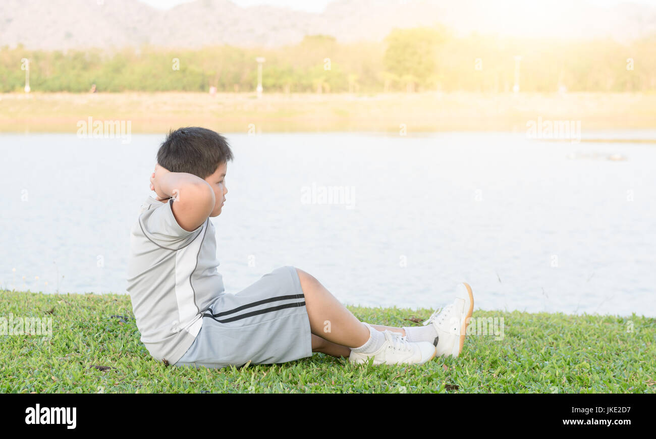 obese fat boy exercise to lose weight. healthy concept Stock Photo - Alamy