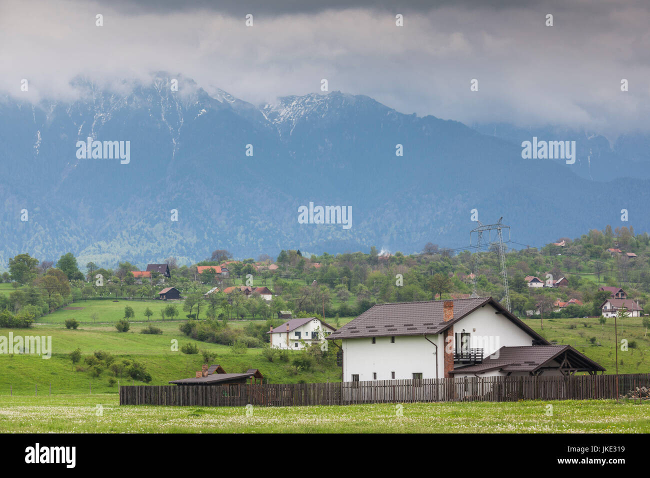Romania, Transylvania, Bran, house and Bucegi Mountains, spring Stock ...