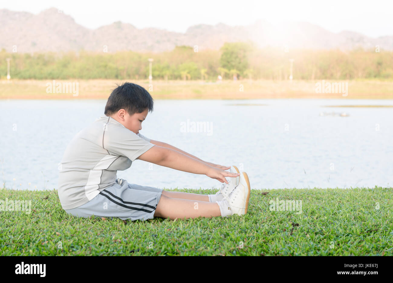 obese fat boy exercise to lose weight. healthy concept Stock Photo - Alamy