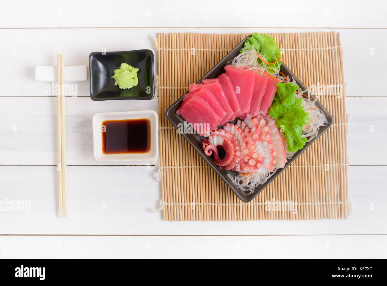 sashimi tuna and squid top view on wood background, raw food and ...