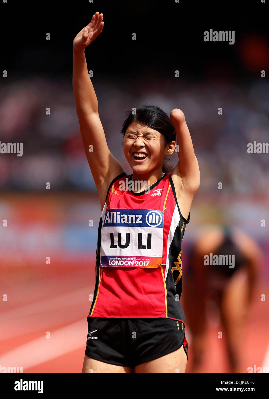 China's Li Lu celebrates winning the Women's 400m T47 final during day ...