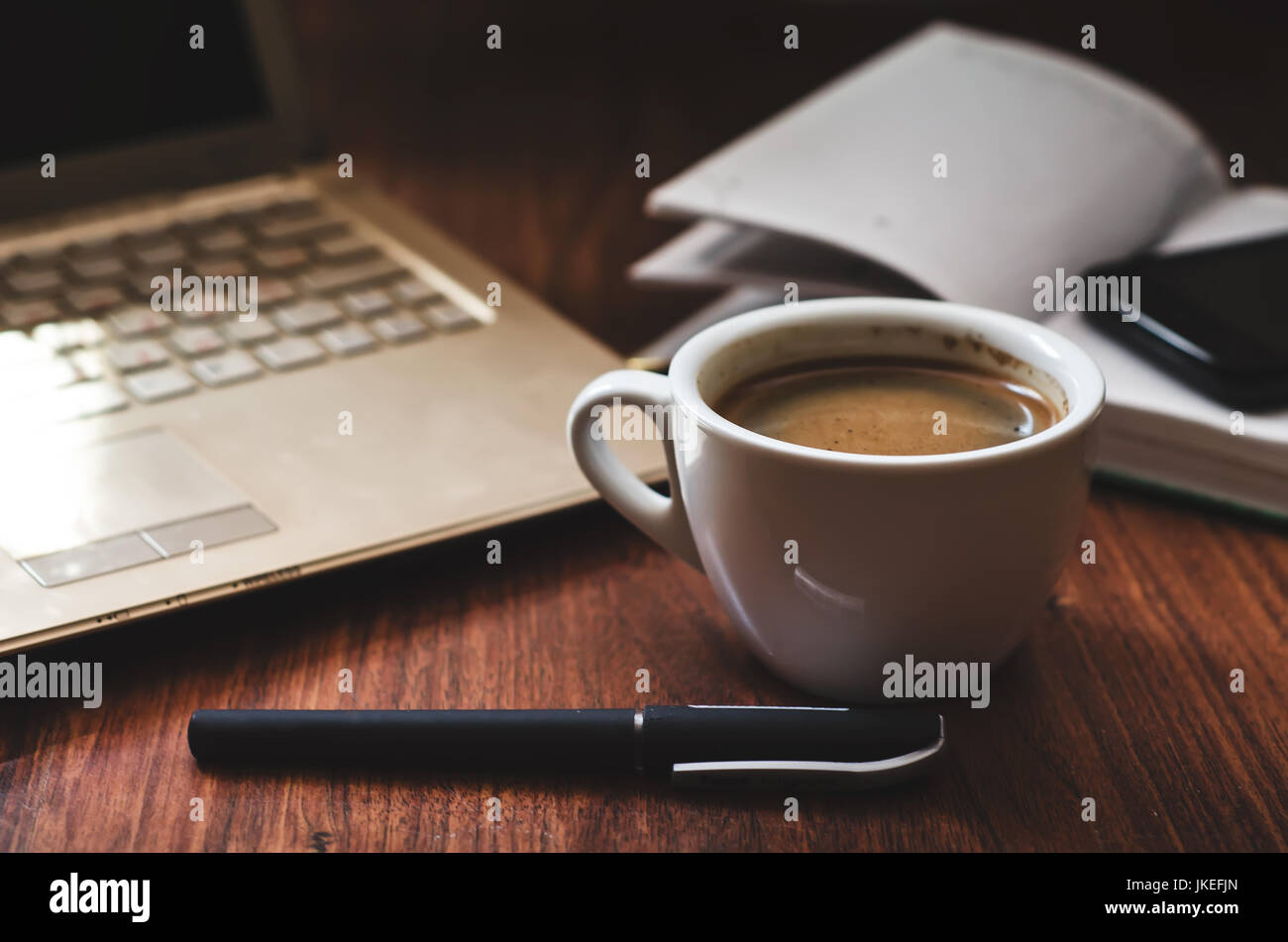 Laptop, cup of coffee and notepad. Business, Freelance concept Stock ...