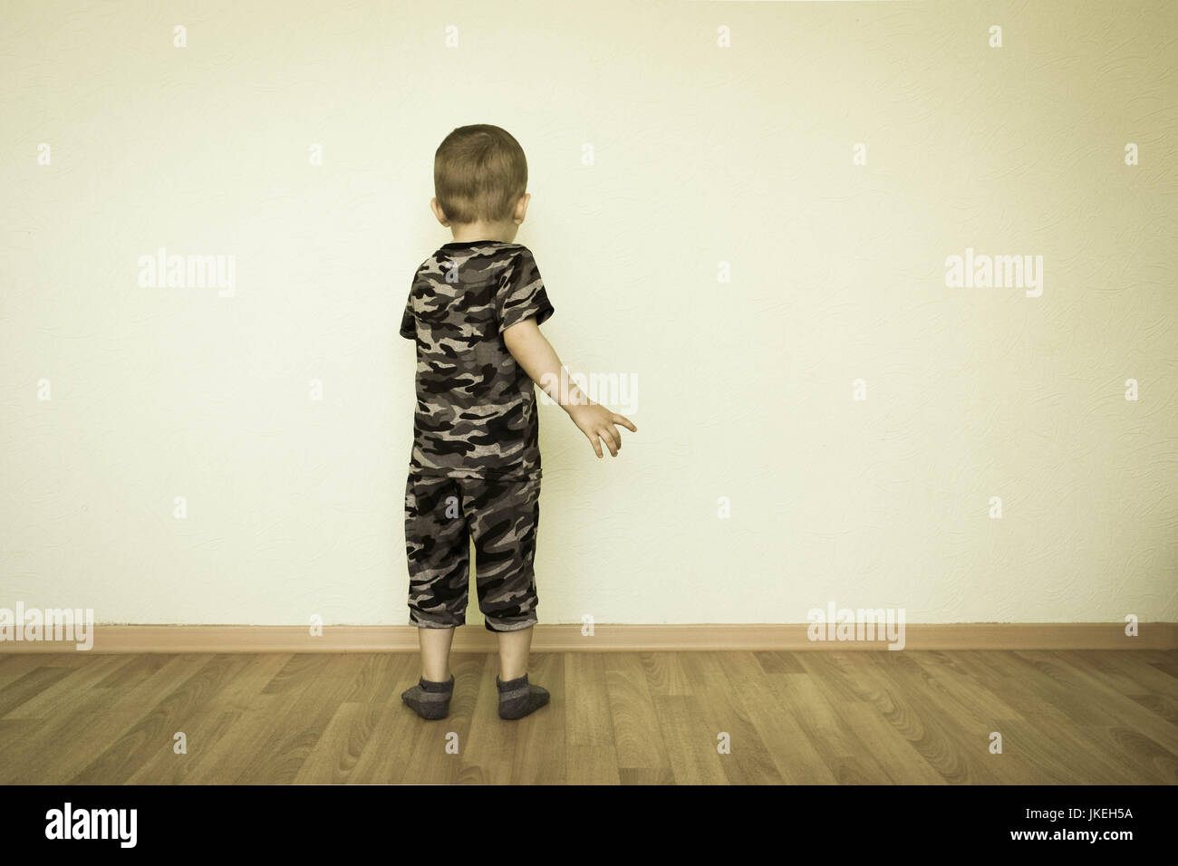 Concept of learning. The child is at the wall. Photo for your design ...