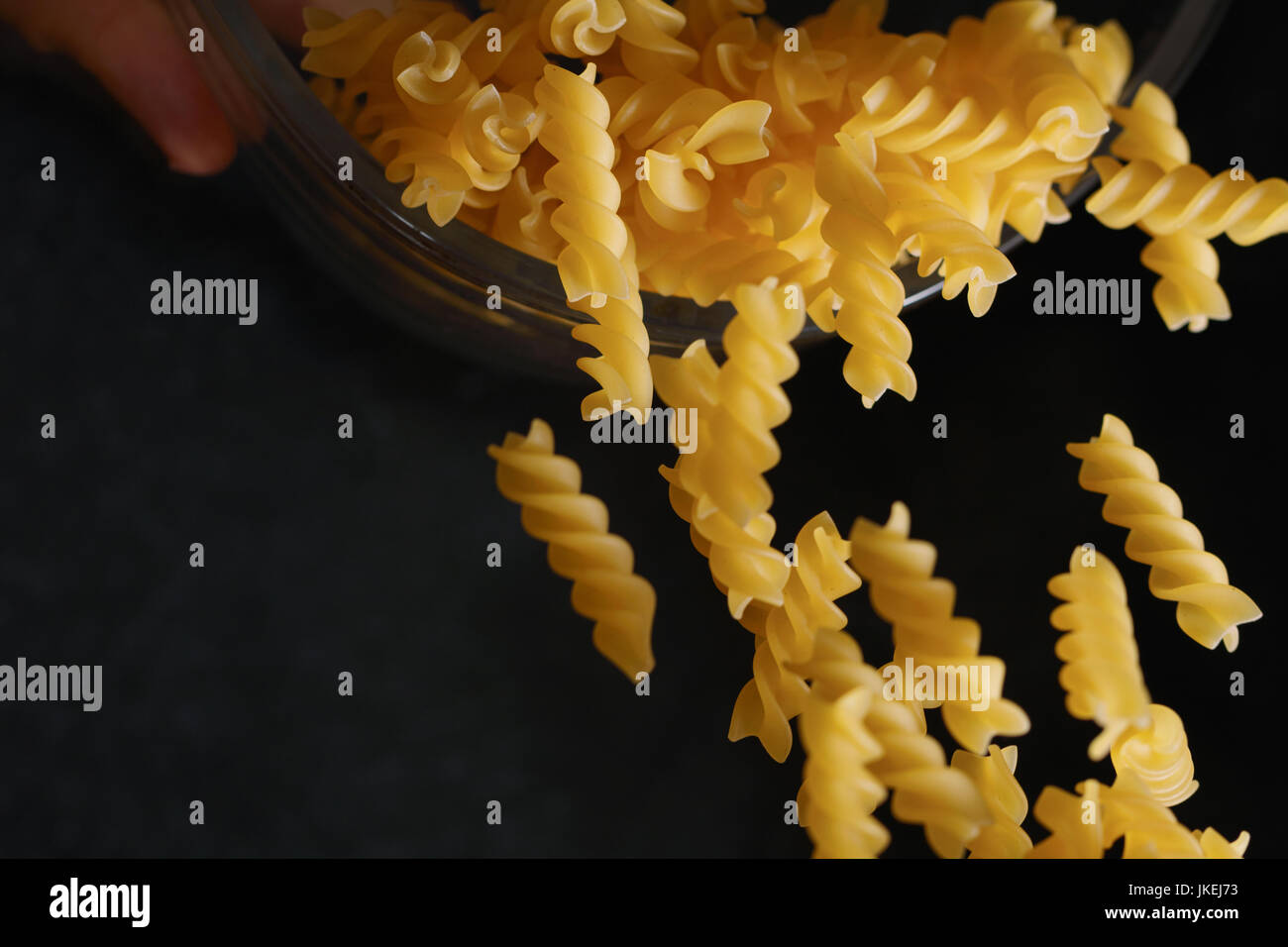 Flying pasta on dark background. Food motion Stock Photo - Alamy