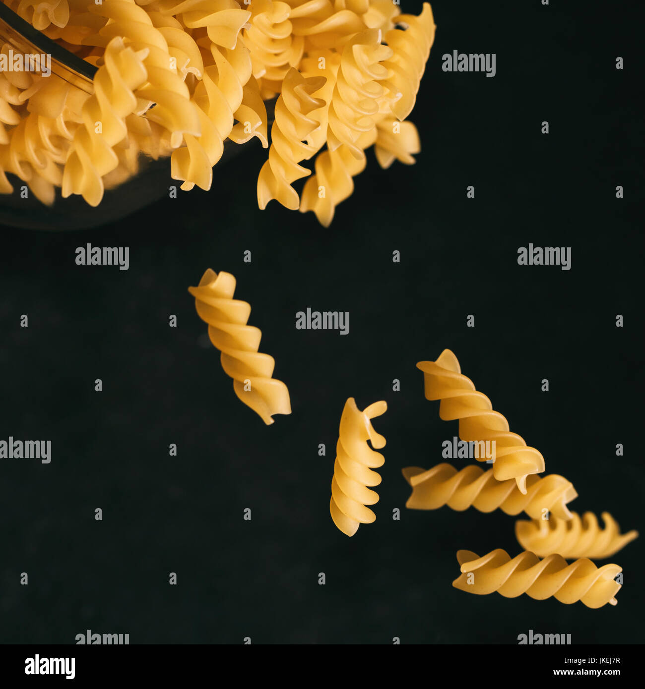 Flying pasta on dark background. Food motion Stock Photo - Alamy