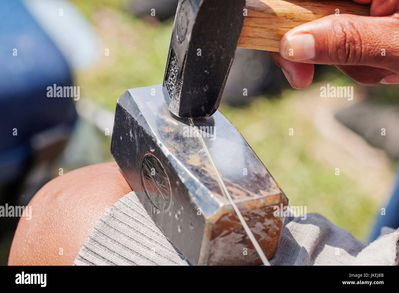 Peruvian jewelry artist making a ring from alpaca metal string Stock ...