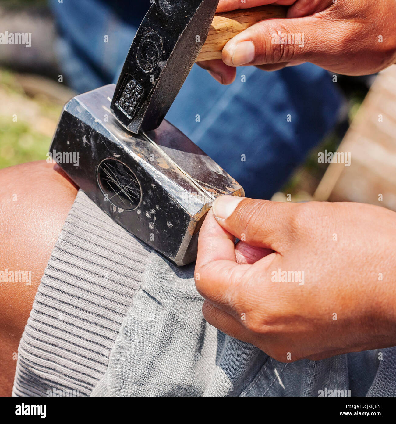 Peruvian jewelry artist making a ring from alpaca metal string Stock ...