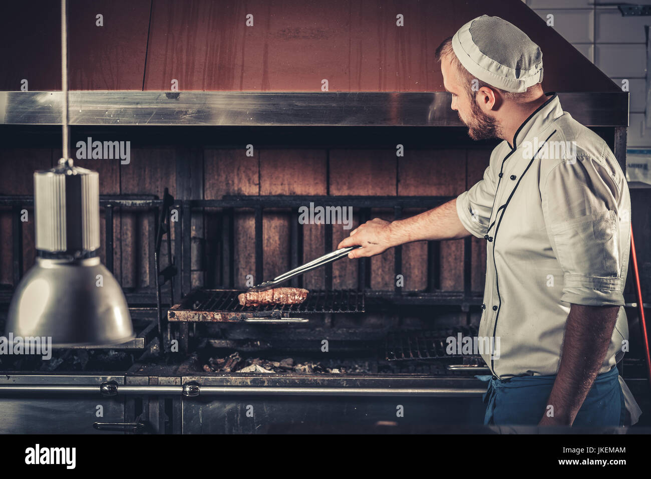 Preparing traditional beef steak Stock Photo - Alamy