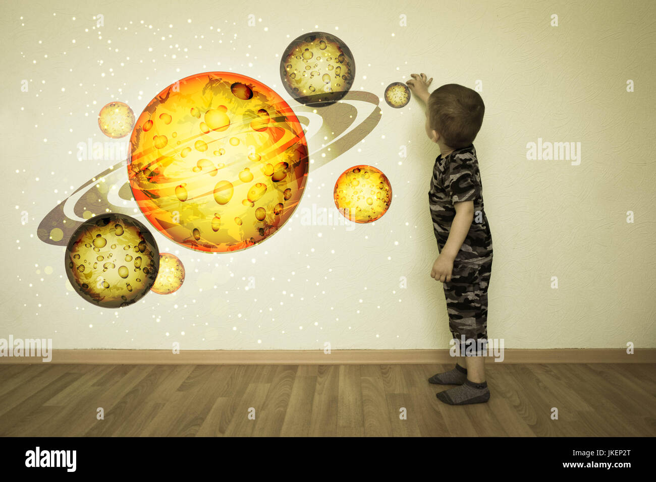 The concept of a future profession. Astronaut and space. A little boy ...