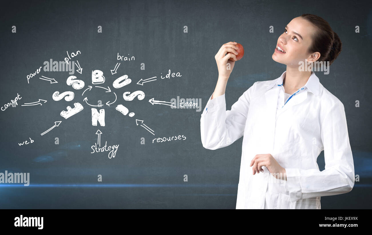 Beautiful medical woman doctor in uniform. Studio painted background ...