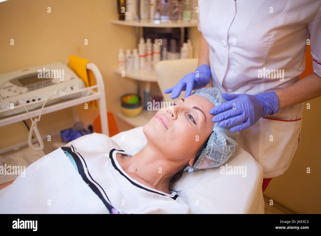 Cosmetology doctor makes facial procedures Stock Photo - Alamy