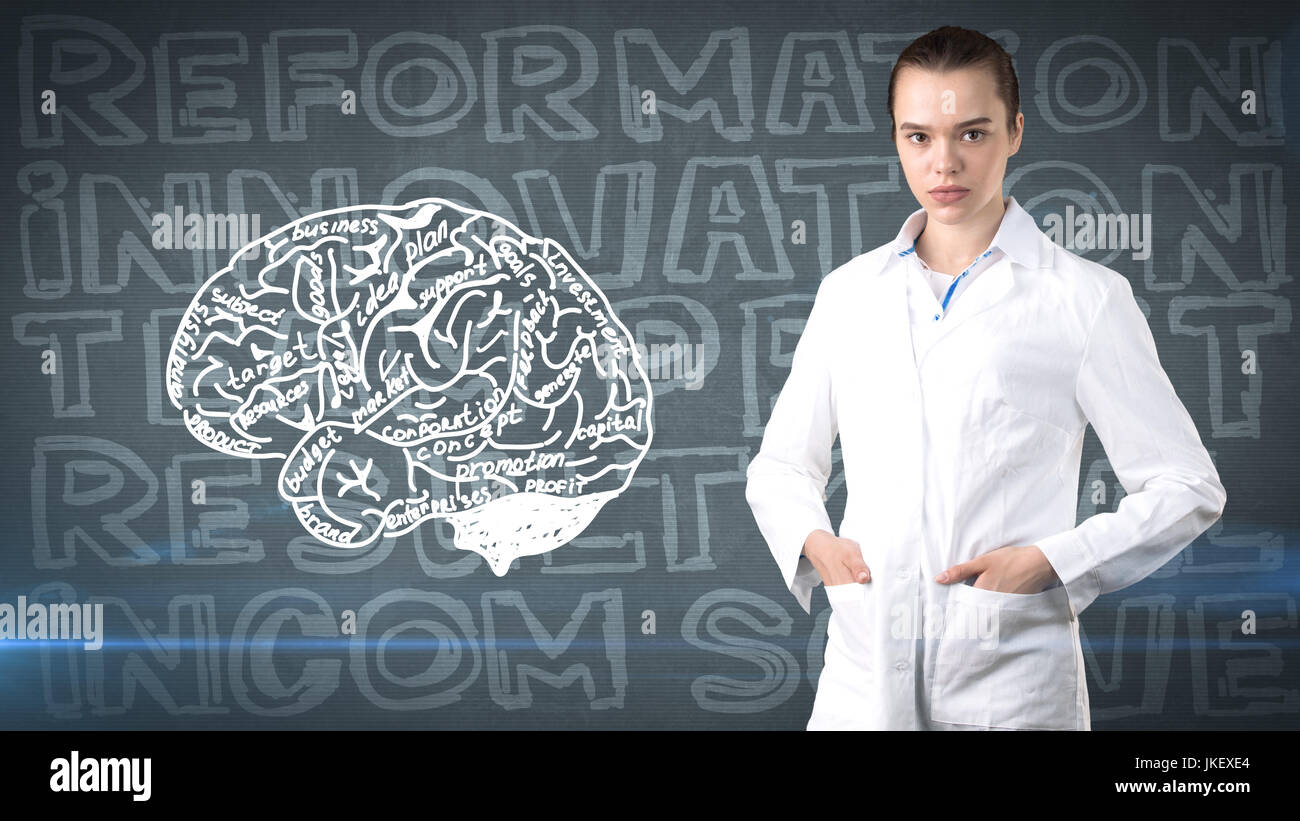 Beautiful medical woman doctor in uniform. Studio painted background ...