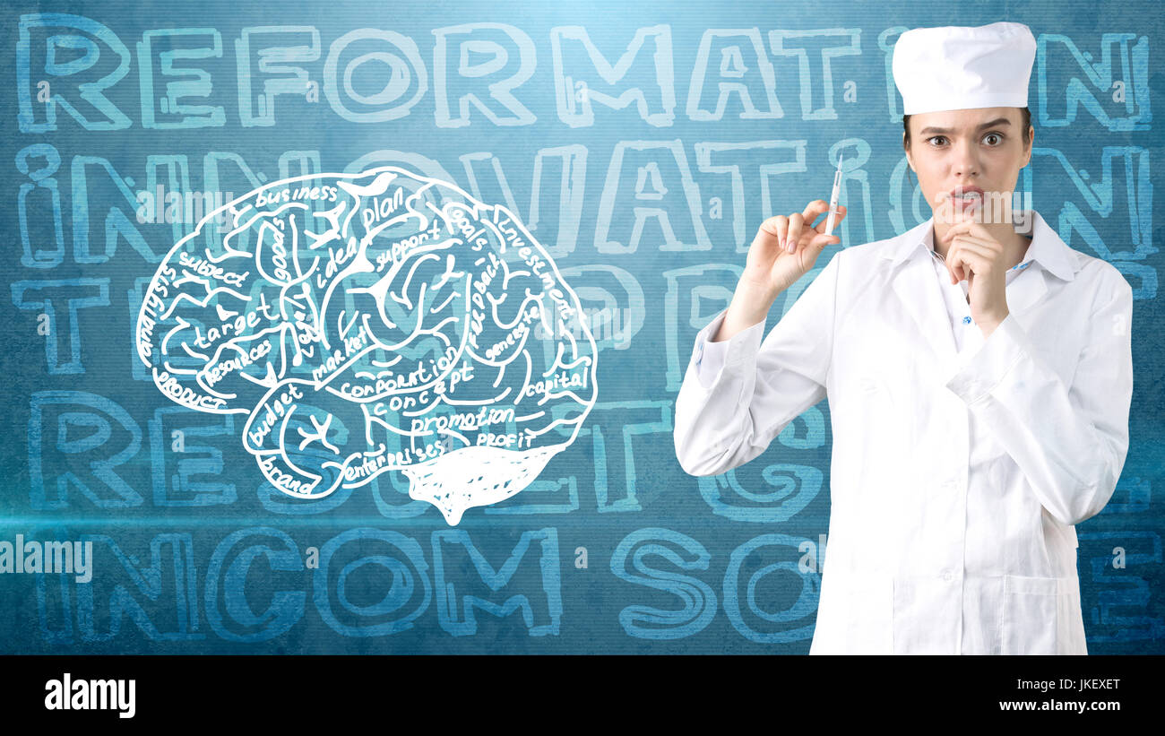 Beautiful medical woman doctor in uniform. Studio painted background ...